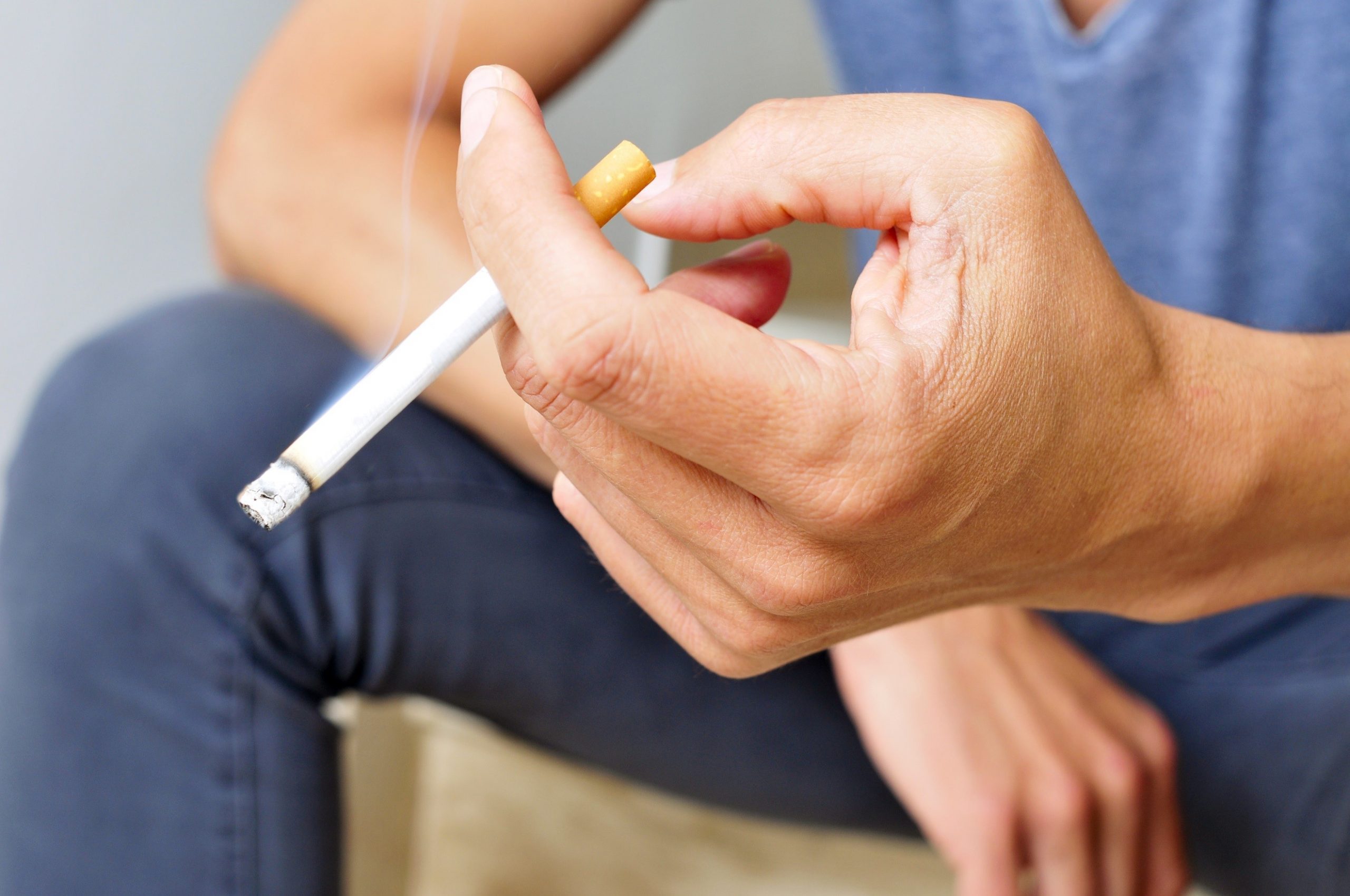 Person Holding Cigarette